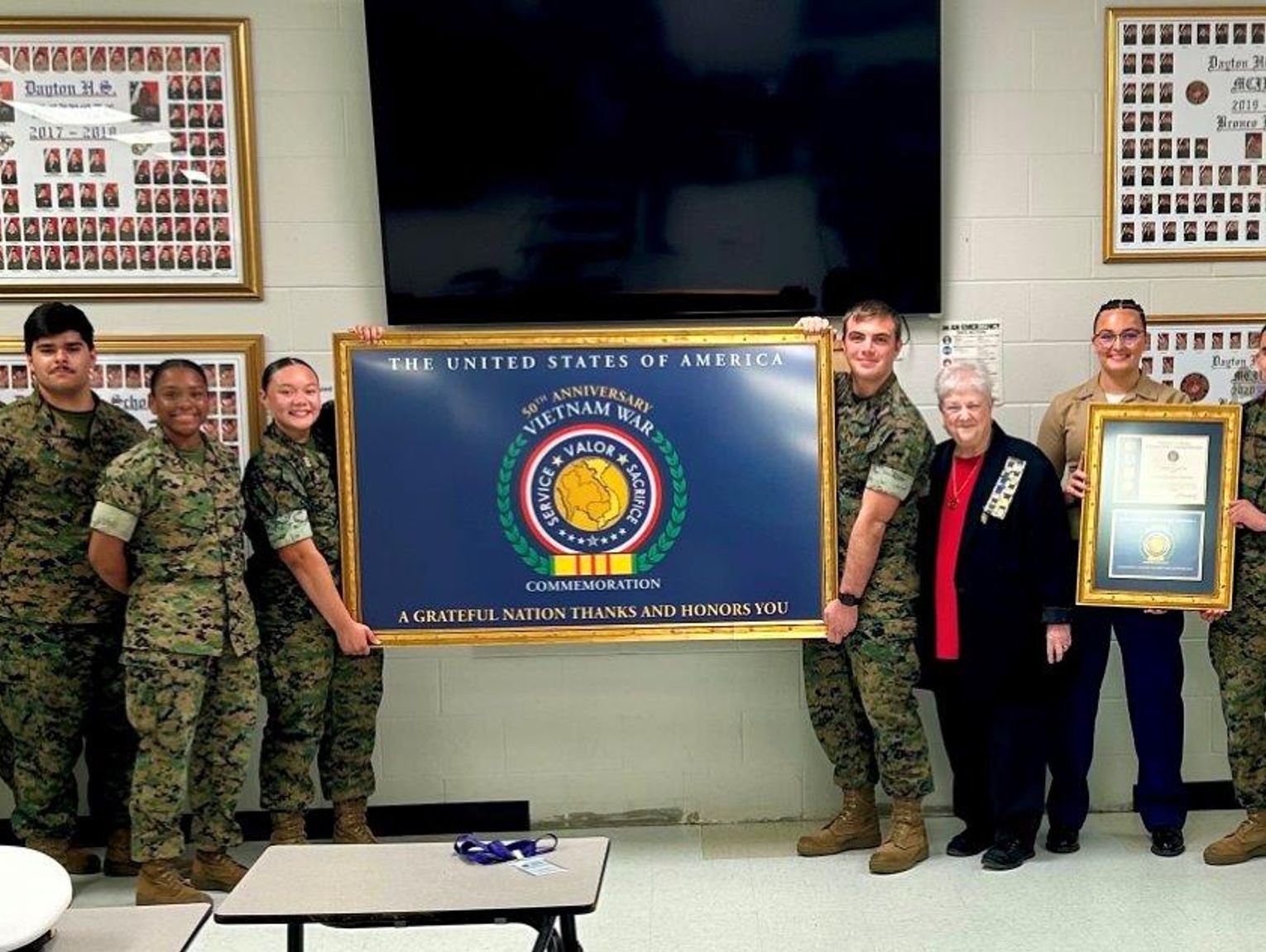 LIBERTARD DAR PRESENTS FLAG TO DHS MCJROTC